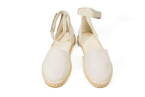 Closeup Macro View Of Eggshell Espadrilles Shoes On White Background