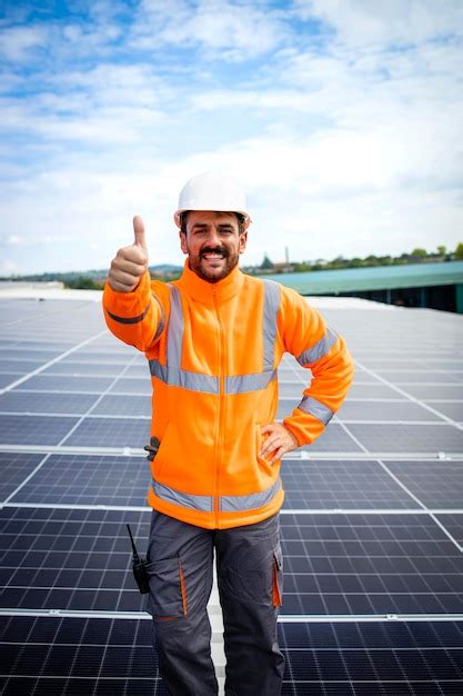 Premium Photo Installation Of Solar Panels And Professional Worker