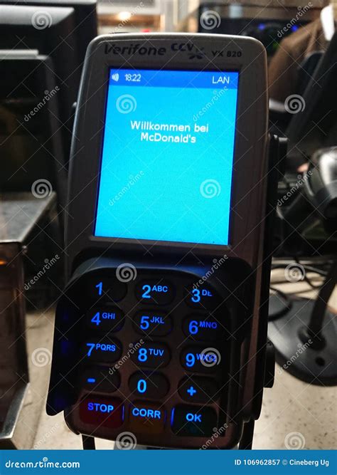 A Verifone Payment Terminal At A Gas Pump Featuring A Keypad Card