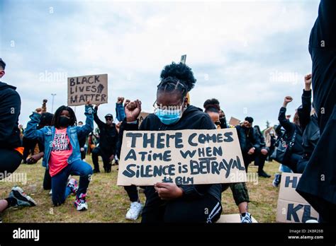 A Black Woman Is Taking A Knee During The Second Massive Black Lives