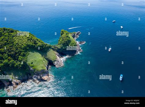 Aerial Drone View Of A Remote Beautiful Tropical Island Surrounded By