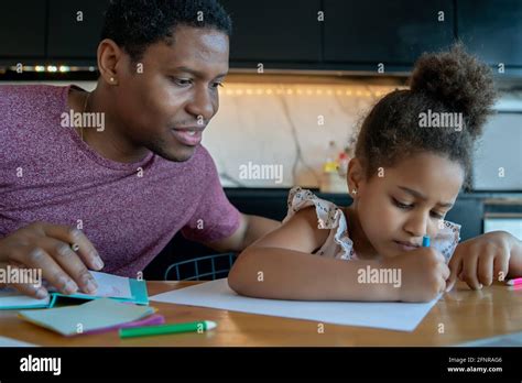 A Father Helping His Babe With Homebabe Stock Photo Alamy