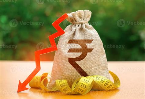 Indian Rupee Money Bag With Down Arrow And Measure Tape Reduced Wages