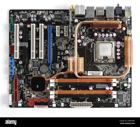 Computer Motherboard With A CPU In A Socket And Extension Slots Isolated On White Stock Photo