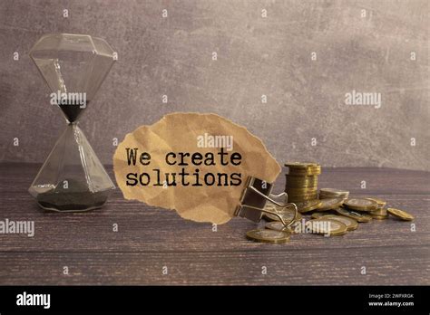 Text Text We Create Solutions Appearing Behind Torn Brown Paper Stock