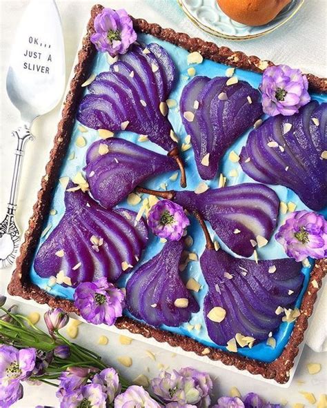 Purple Flowers And Blue Icing Cake With Nuts