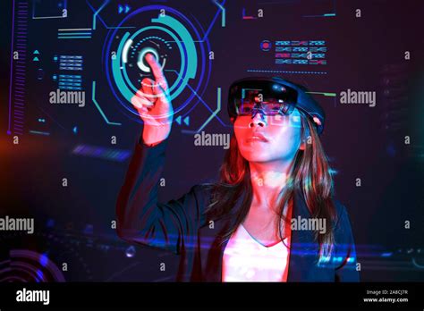 Young Asian Girl Try Augmented And Virtural Reality Glasses Hololens In