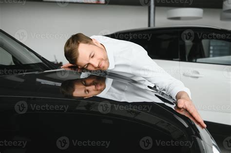Visiting Car Dealership Handsome Bearded Man Is Stroking His New Car