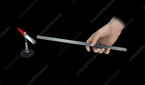 Attracting A Compass Needle With A Magnetized Object Stock Image