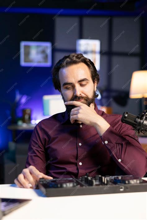 Premium Photo Artist Filming Dj Mixing Tutorial Thinking Of Examples Of Sampling