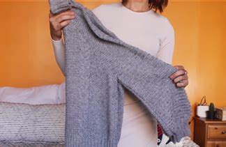 How To Hang Your Sweaters Without Ruining Them Sweater Hanging