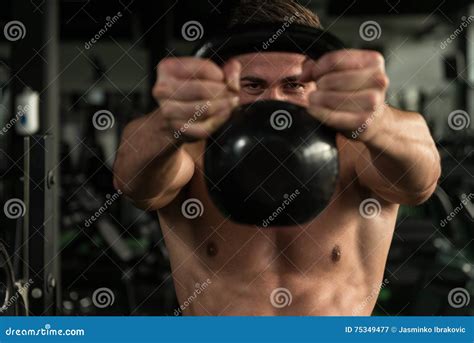 Fitness Man Using Kettlebells Inside Gym Stock Image Image Of