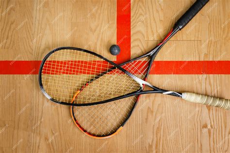 Premium Photo Squash Rackets And Ball On Court Floor Top View