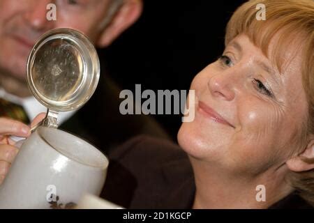 German Chancellor Angela Merkel Drinks One Litre Of Beer In A Beer Stock Photo Alamy