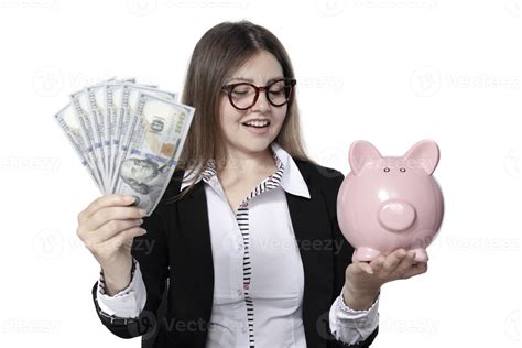 Saving Concept Beautiful Female Model Saving Her Money In A Piggy Bank