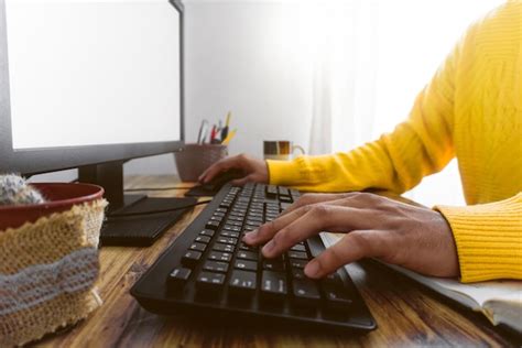 Premium Photo Hands Of An Unrecognizable Person Typing On A Computer Keyboard