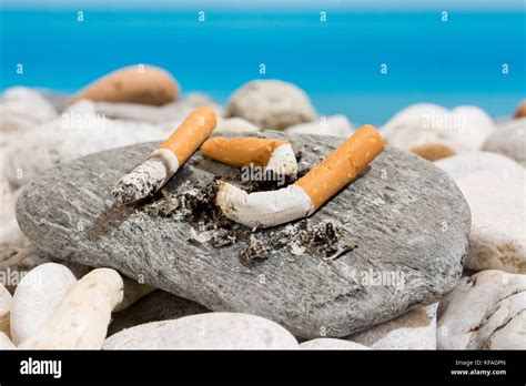 Cigarette Butts On The Beach Stock Photo Alamy