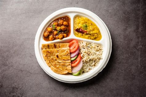 Premium Photo Indian Mini Meal Parcel Platter Combo Thali With Chole Masala Roti Dal Tarka
