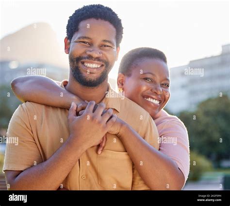 Portrait Happy And Couple Smile With Hug While In The City On A Date