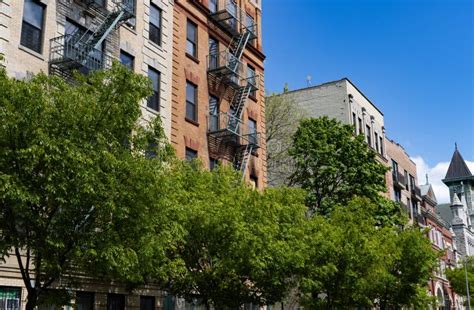 Row Of Old Brick Residential And Apartment Buildings In East Harlem Of