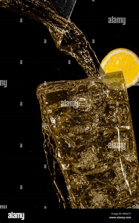 Sparkling Water Overflow Over Ice Cubes Stock Photo Alamy
