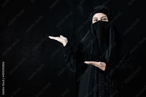 Muslim Woman In Hijab And Showing Pose On Black Background Stock Photo Adobe Stock