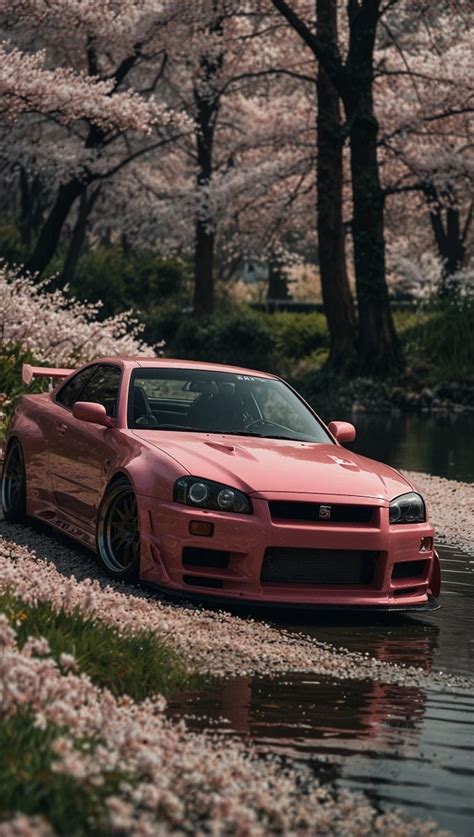 A Nissan Gtr On A Pristine Lake Surrounded By Cherry Blossoms Pink