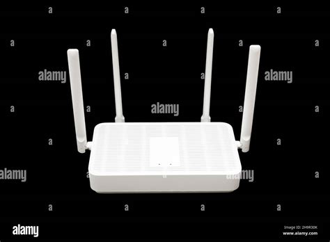 Modern Wifi 6 Router With Four Antennas Isolated On Black Background