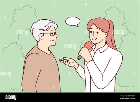 Female Journalist With Microphone Interview Elderly Man In Park Woman