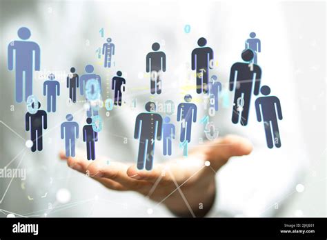 A Hologram Of Interconnected People And Binary Code On A Businessmans