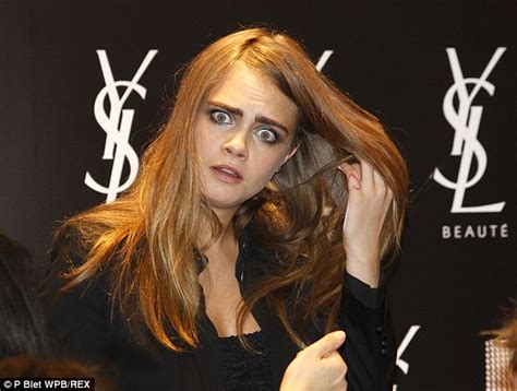 Cara Delevingne Pulls A Series Of Funny Faces As She Attends Yves Saint Laurent Press Call