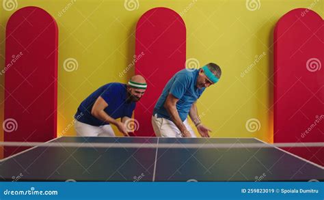 Handsome Two Men Dancing Excited Before Start To Play On The Ping Pong Game In Front Of The