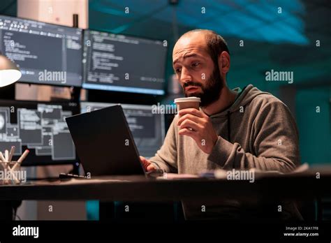 Overworked Coder Drinking Coffee Cup And Programming Html Script In