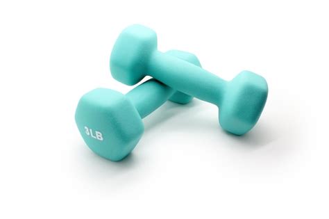Premium Photo Close Up Of Light Weight Dumbells Over White Background