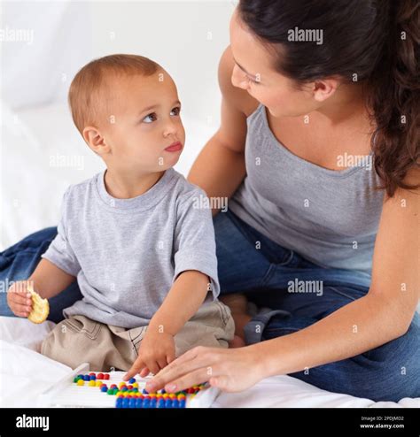 Eating A Tasty Cracker An Adorable Little Boy Eating A Cracker And