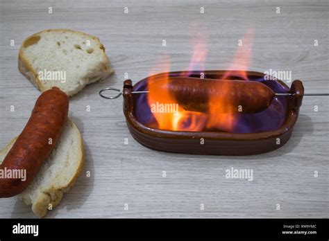 Chorizo Al Infierno Typical Dish Of Spanish Cuisine Chorizo In A Clay