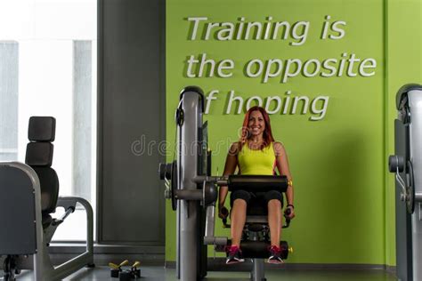 Young Woman On Leg Exercise Machine Stock Image Image Of Exercises