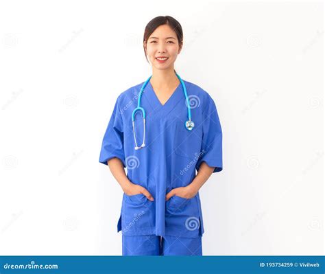 Young Asian Nurse Wearing Blue Uniform And Stethoscope Stock Image