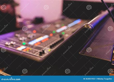 View Of Lighting Engineer Operator Working On Mixing Console Workplace During Live Event Concert