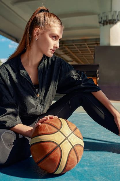 Premium Photo Beautiful Woman In Sports Uniform With A Basketball