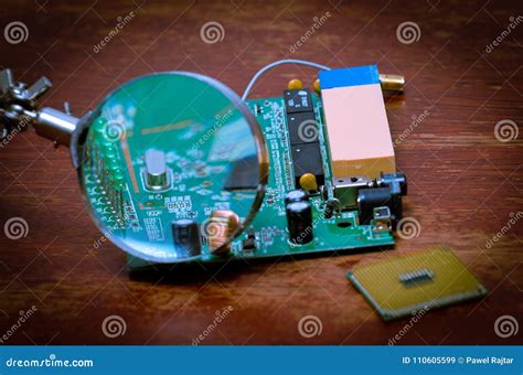 Electronic Printed Circuit Board With Soldered Cable View Through A Magnifying Glass Stock