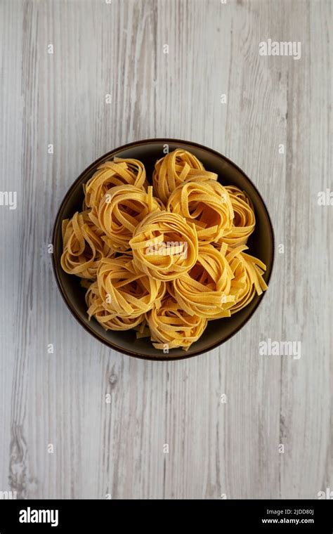Homemade Organic Dry Tagliatelle Pasta In A Bowl Top View Flat Lay