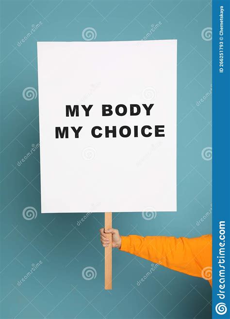 Woman Holding Placard With Phrase My Body My Choice On Light Blue