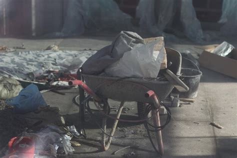 Premium Photo High Angle View Of Wheelbarrow With Garbage In