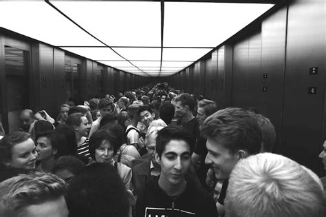 Premium Photo Crowd In Building Corridor