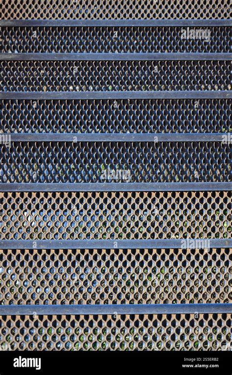 Texture Steps Of Rusty Metal Mesh In The Sections Of The Metal Strips