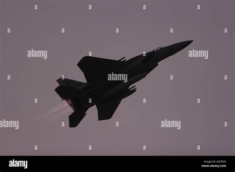 An F 15e Strike Eagle With Afterburner On Ascending Into The Sky After
