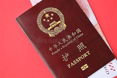 Red Passport Of People Republic Of China And Chinese Yuan Money Bills