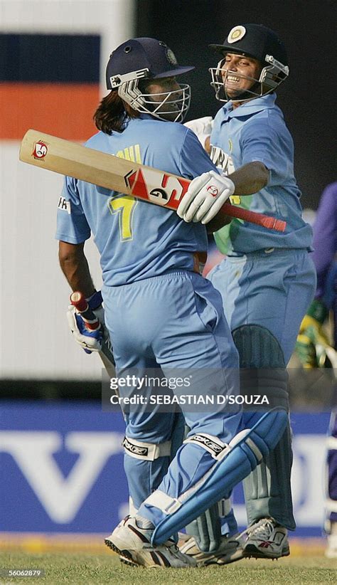 Indian Cricketer Mahendra Singh Dhoni Is Hugged By Teammate Suresh