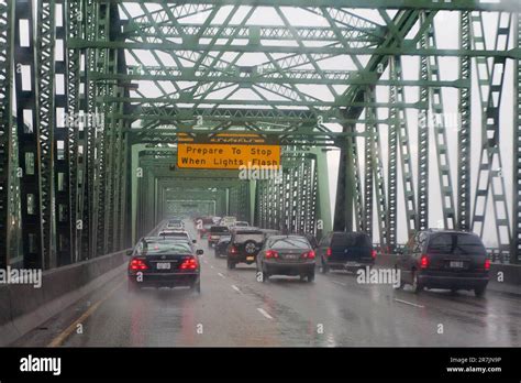 There Is Rain And Heavy Traffic On The Freeway Bridge Which Separate